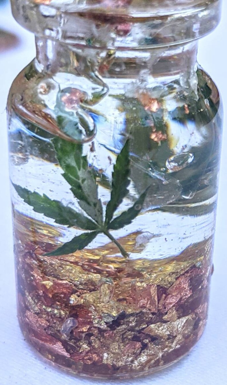 Real marijuana leaf 14kt gold leaf orgonite in a bottle | Etsy