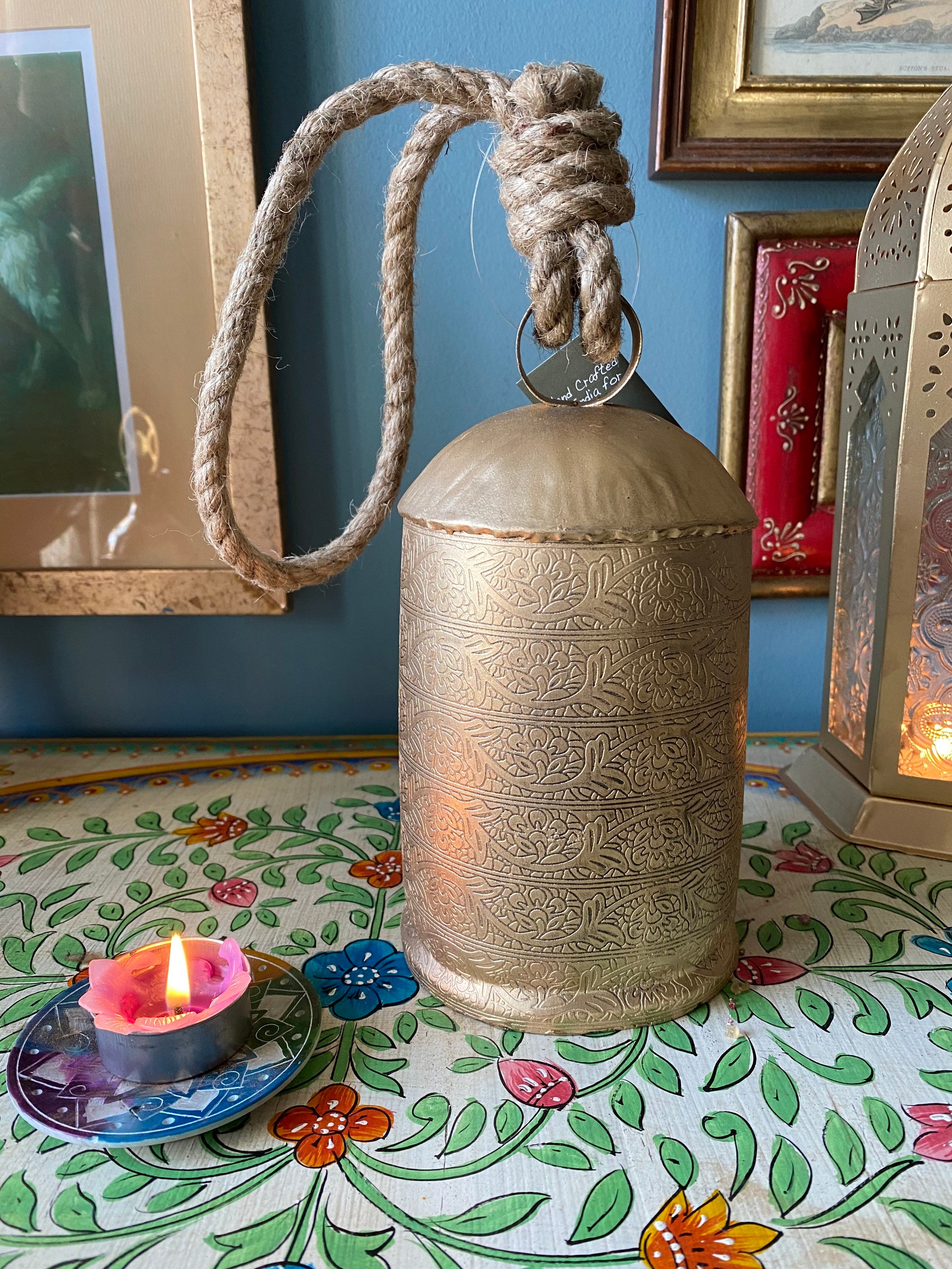 Antiqued gold effect cow bell with jute string | Etsy