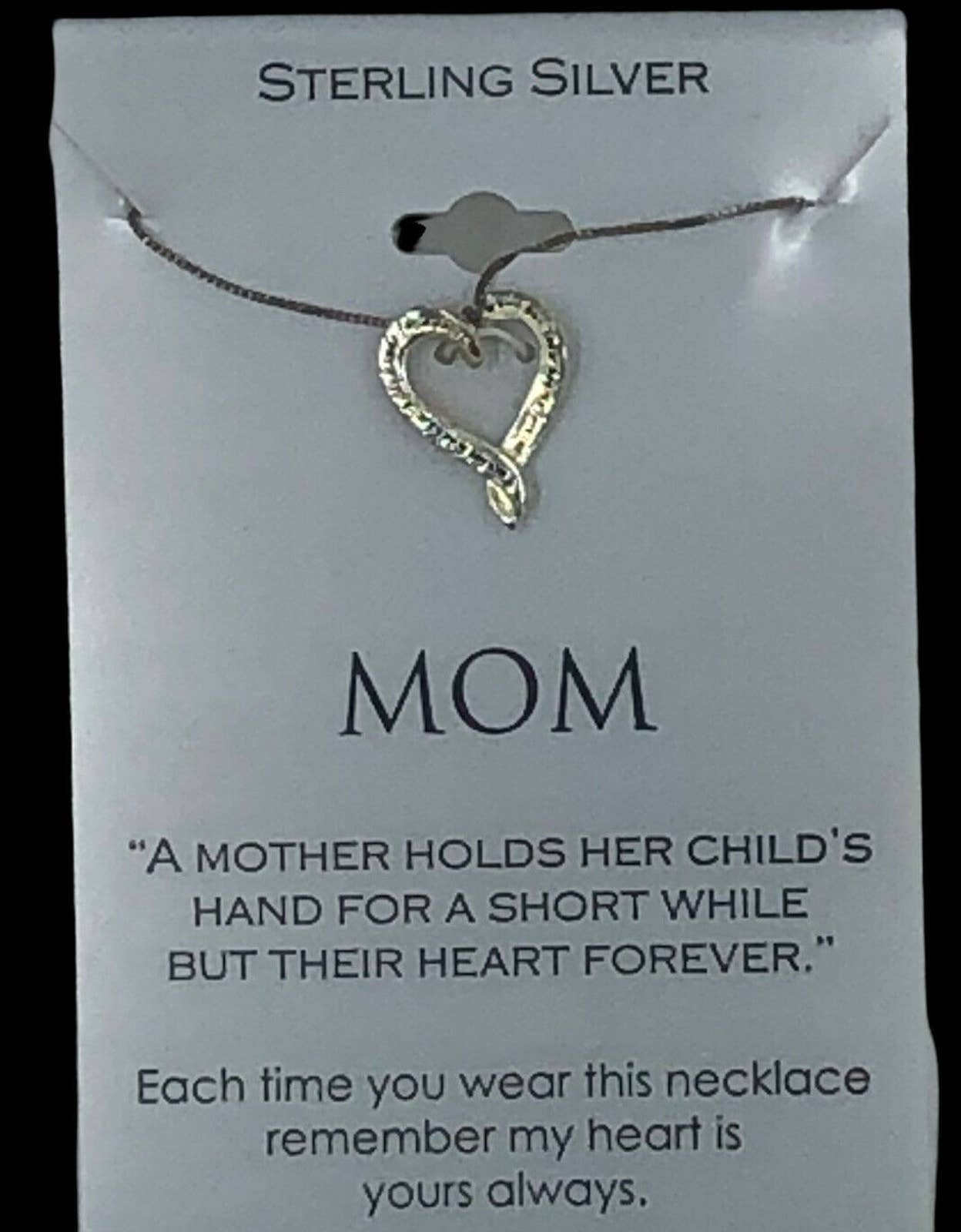My mother wears necklace in her store