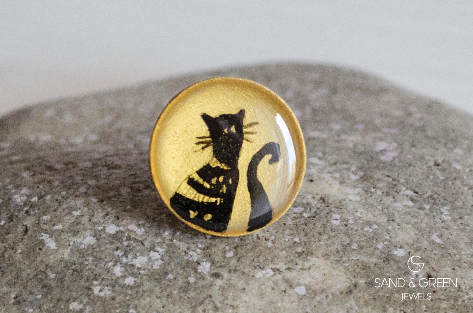 Bronze Round Ring on One Black Cat in Gold Background Theme, Hand ...