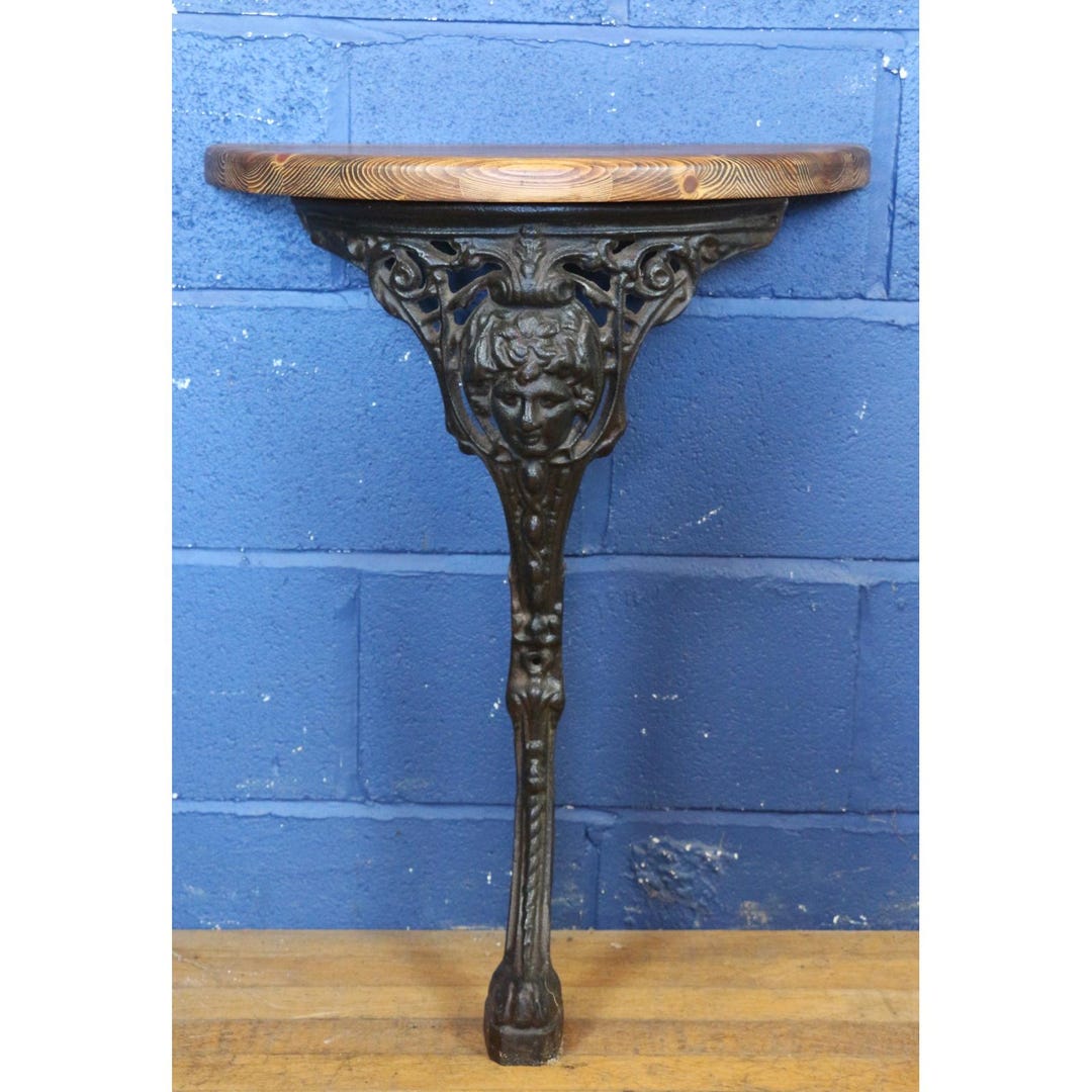 An Ornate Cast Iron Based Console Table With Stained and Polished Pine ...