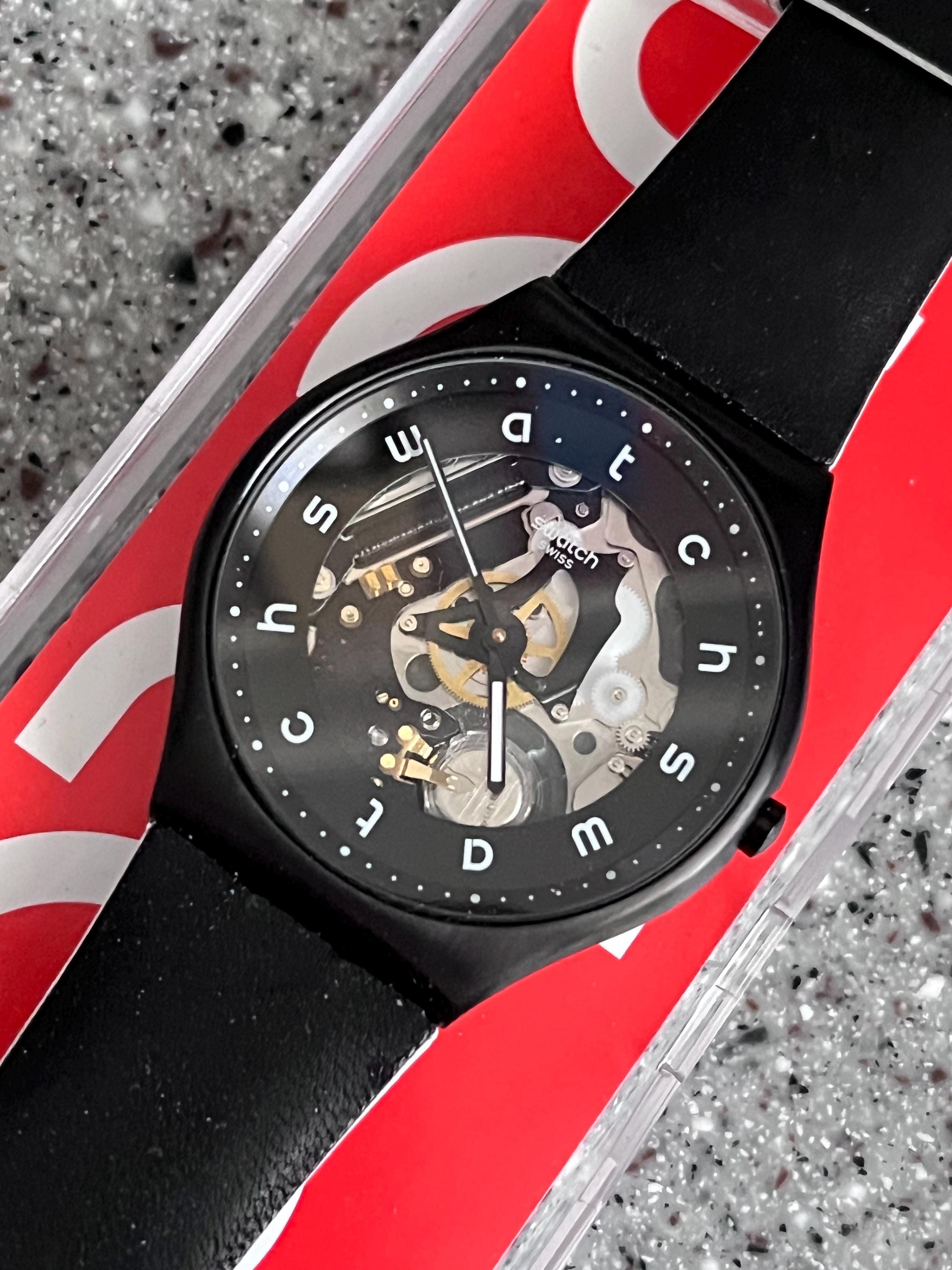 Swatch Watch Black and White Logo SKIN Swatch 42mm Larger Skeleton Dial ...