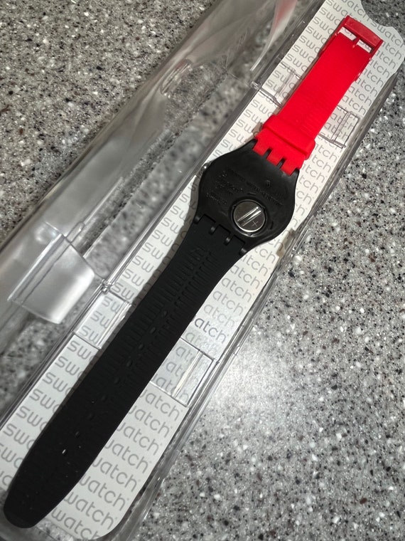 Swatch Watch Mask Parade is an attractive 41mm larger… - Gem