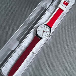 Swatch Watch Called Redtwist Two Shades of Fiery Red Splashed on White ...