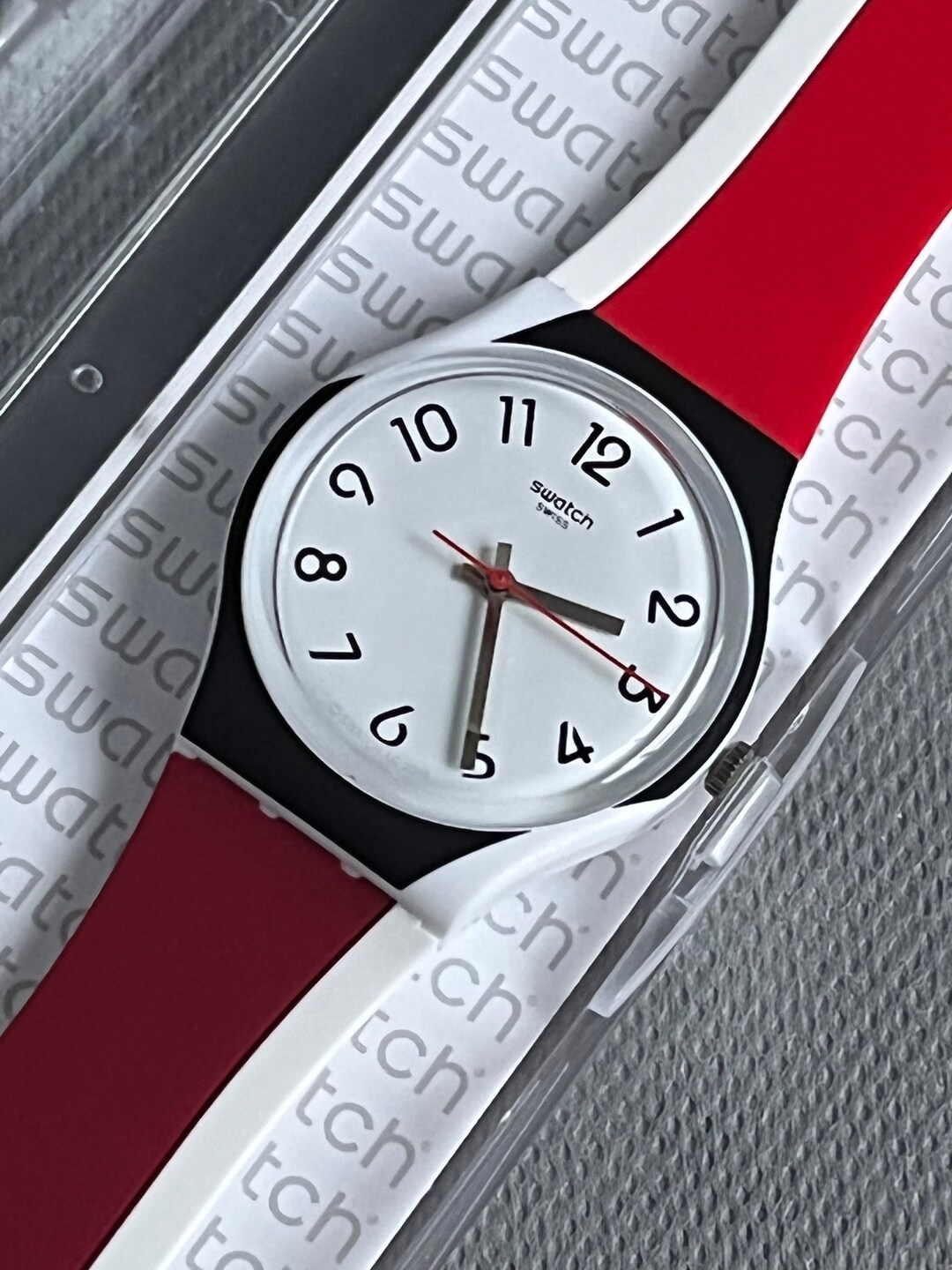 Swatch Watch Called Redtwist Two Shades of Fiery Red Splashed on White ...