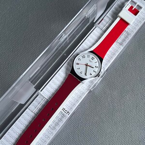 Swatch Watch Called Redtwist Two Shades of Fiery Red Splashed on White ...