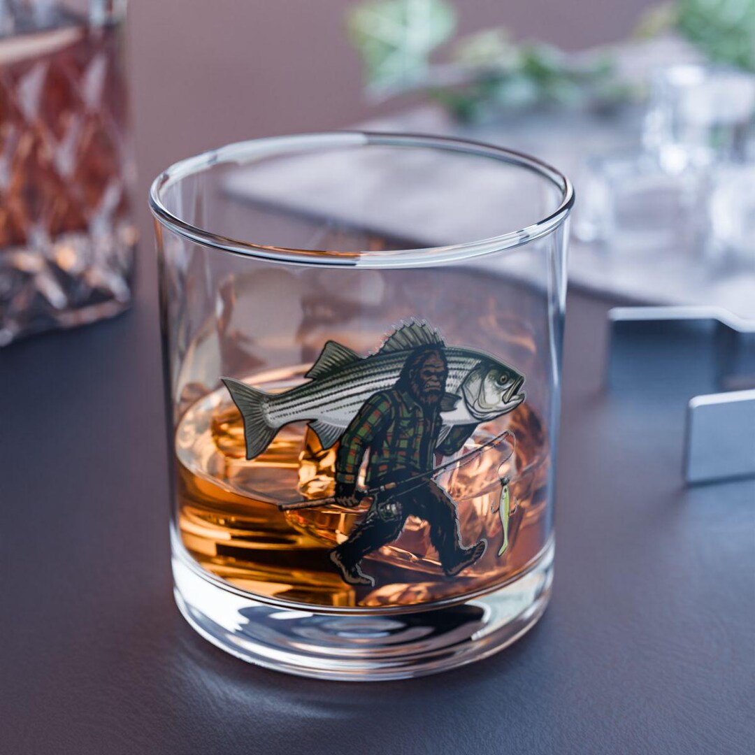 Bigfoot Carrying Trophy Striped Bass Fishing Whiskey Glass, Sasquatch ...