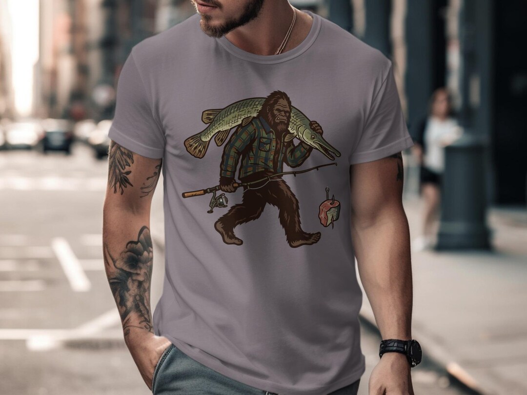 Bigfoot Carrying Alligator Gar Trophy Fish T-shirt Sasquatch Fishing ...
