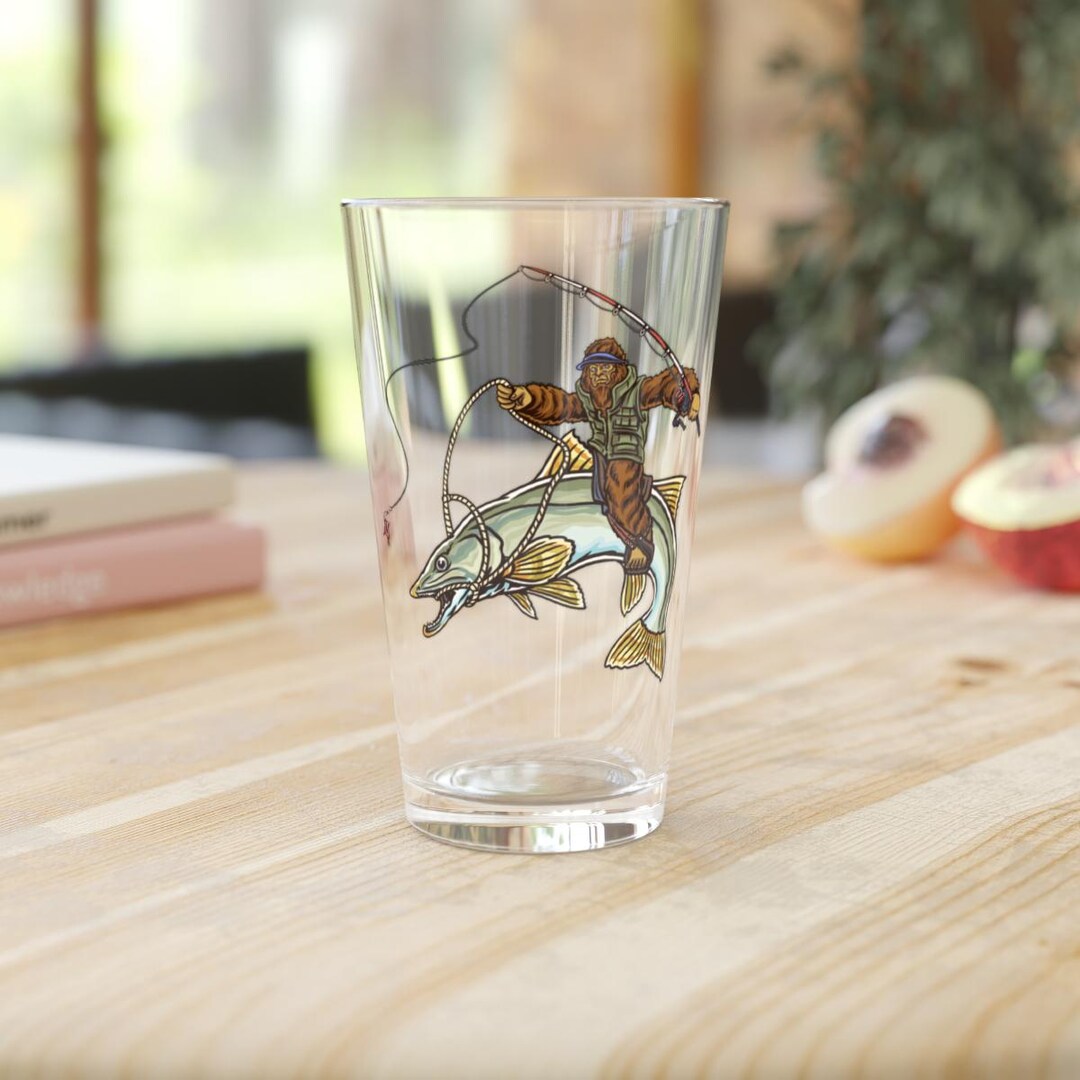 Bigfoot Riding Snook Pint Glass, Funny Sasquatch Fishing Beer Glass for ...