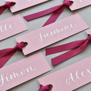 Wedding Place Cards on Dusky Pink Card W Dark Pink Satin Ribbon ...