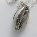 SHELL Cowry Silver Pendant Black Diamonds and Gold on White Coral ...