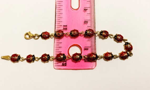 10k solid yellow gold(6mm thick) ladybug bracelet(7"i… - Gem