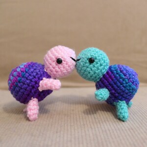 A Mini Multi Colored Turtle With a Light Pink Body/ A Mini Crocheted ...