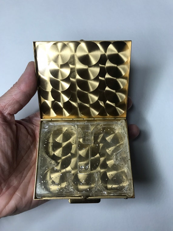 Vintage dollar sign gold metal compact/box/container/… - Gem