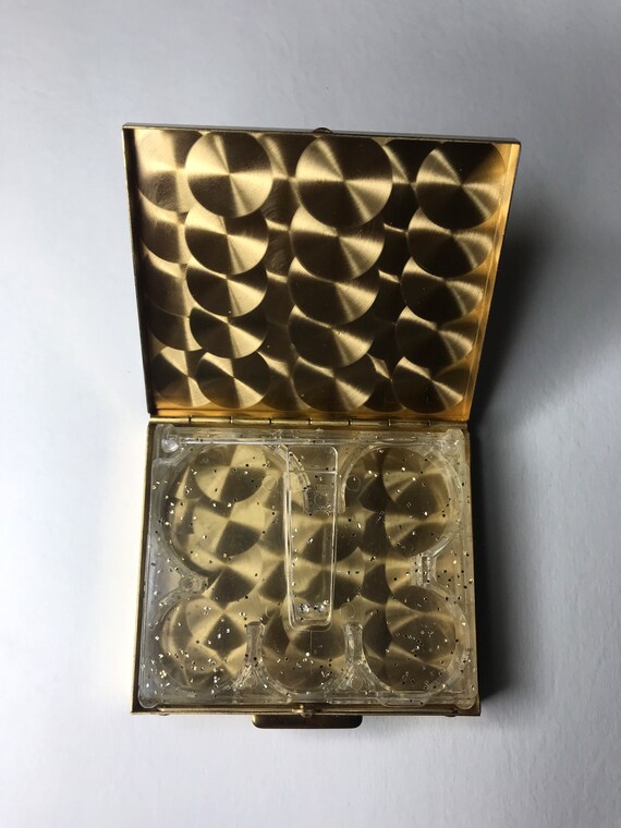 Vintage dollar sign gold metal compact/box/container/… - Gem