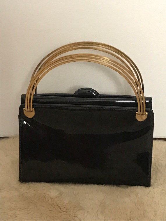 Super gorgeous gold metal handle black handbag - Gem