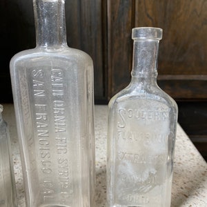 4 Embossed Bottles. Distressed Clear Bottles. 3 Cooking, 1 Medicine ...
