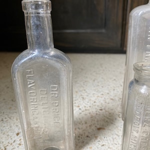 4 Embossed Bottles. Distressed Clear Bottles. 3 Cooking, 1 Medicine Vintage Bottle Collection ...
