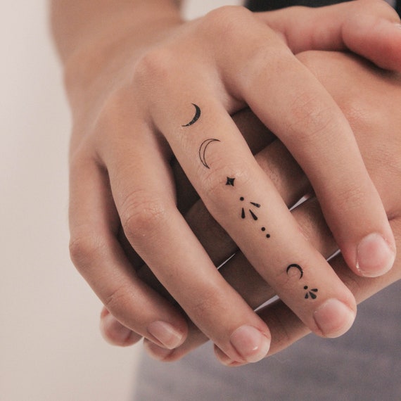Simple Crescent Moon Finger Tattoo