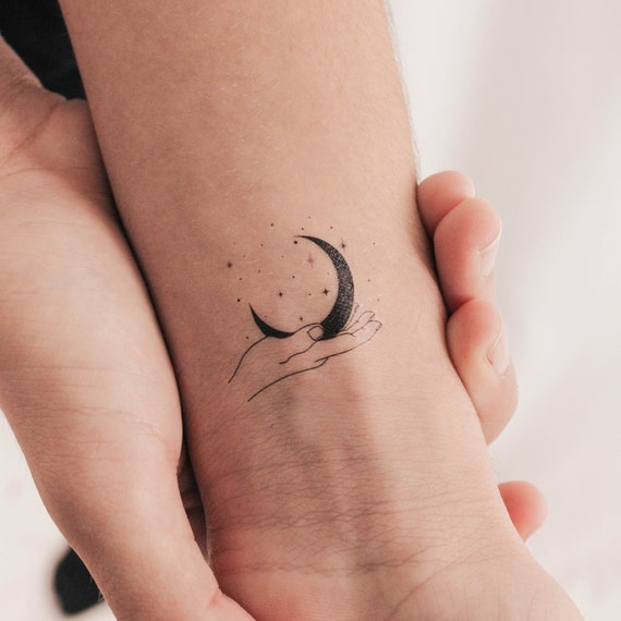 Asteroid Hand Tattoo