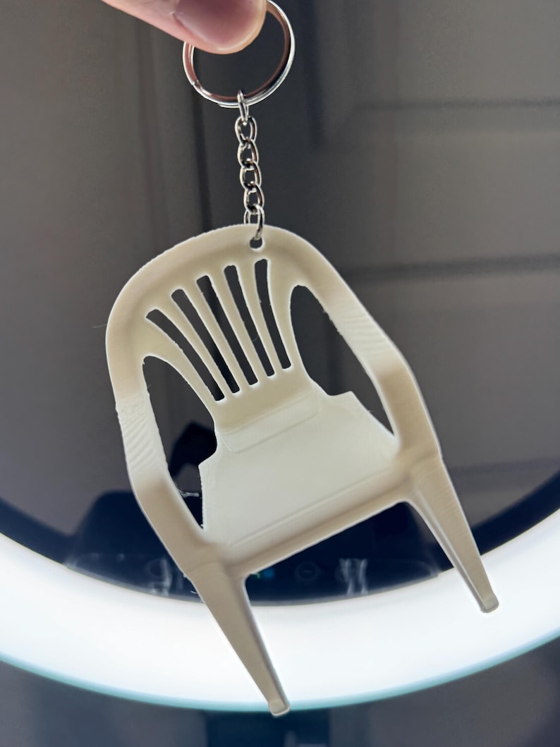 DTMF 1 Keychain of the Classic White Monobloque Chair Bad Bunny Album ...