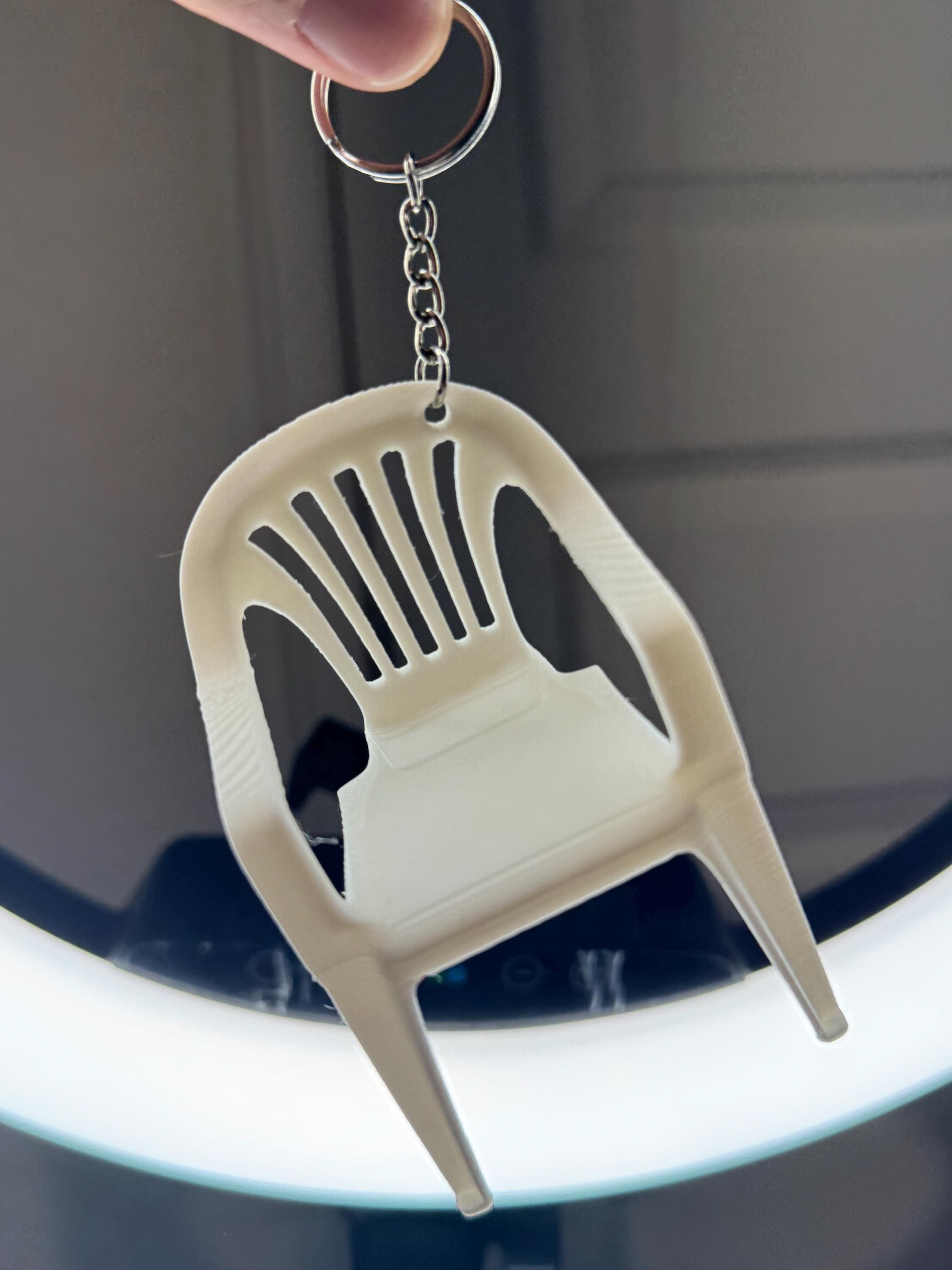 DTMF 1 Keychain of the Classic White Monobloque Chair Bad Bunny Album ...