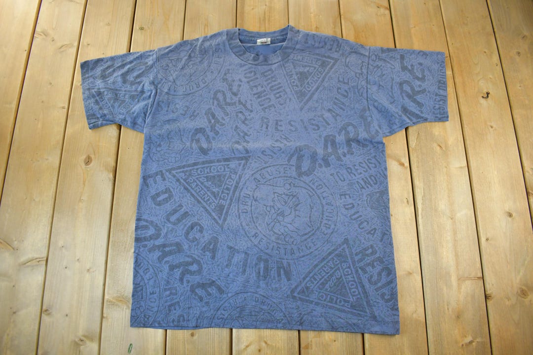 Vintage 1990s D.A.R.E All Over Print Graphic T-shirt Men's XL / Made in ...