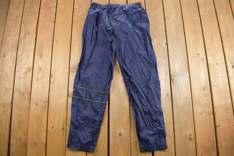 Vintage 1990s Nike Mini Swoosh Track Pants Size XL / Stripe / Nike ...