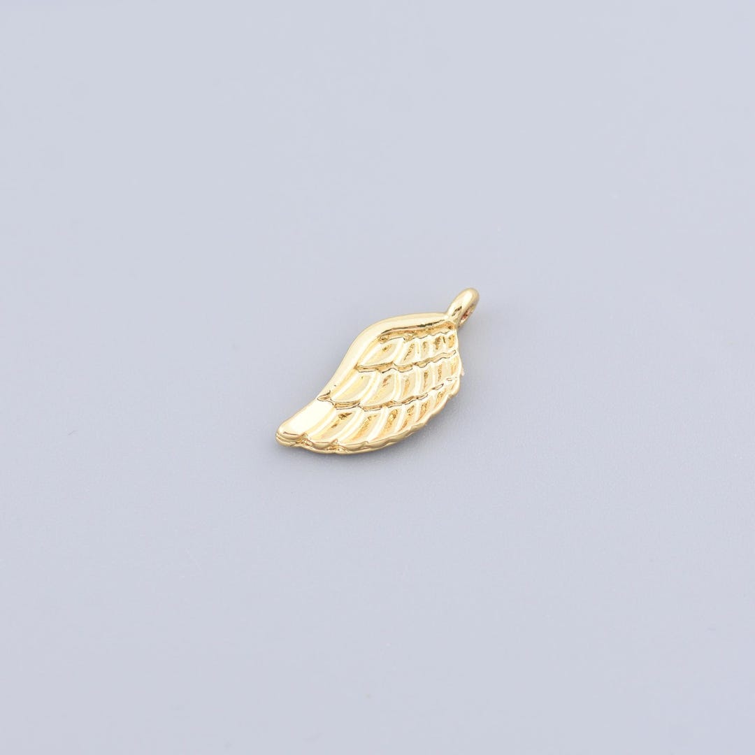 Celestial Wing Pendant in Gold With Detailed Texture - Symbolic Symbol ...