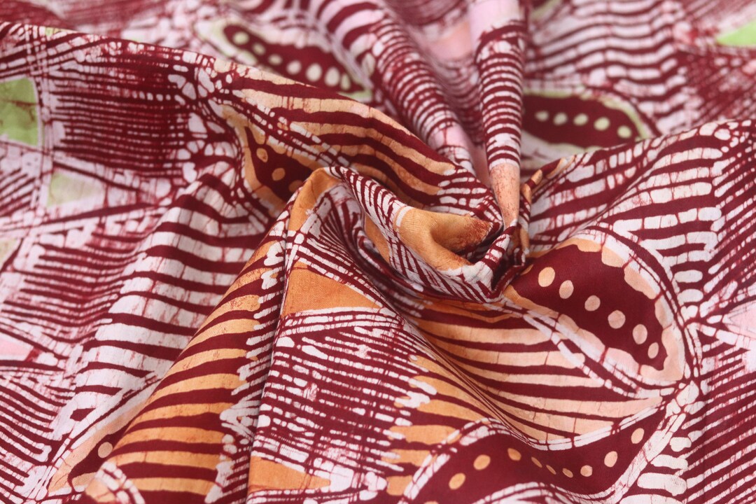 Multicoloured cassava flower inspired hand printed African adire batik ...