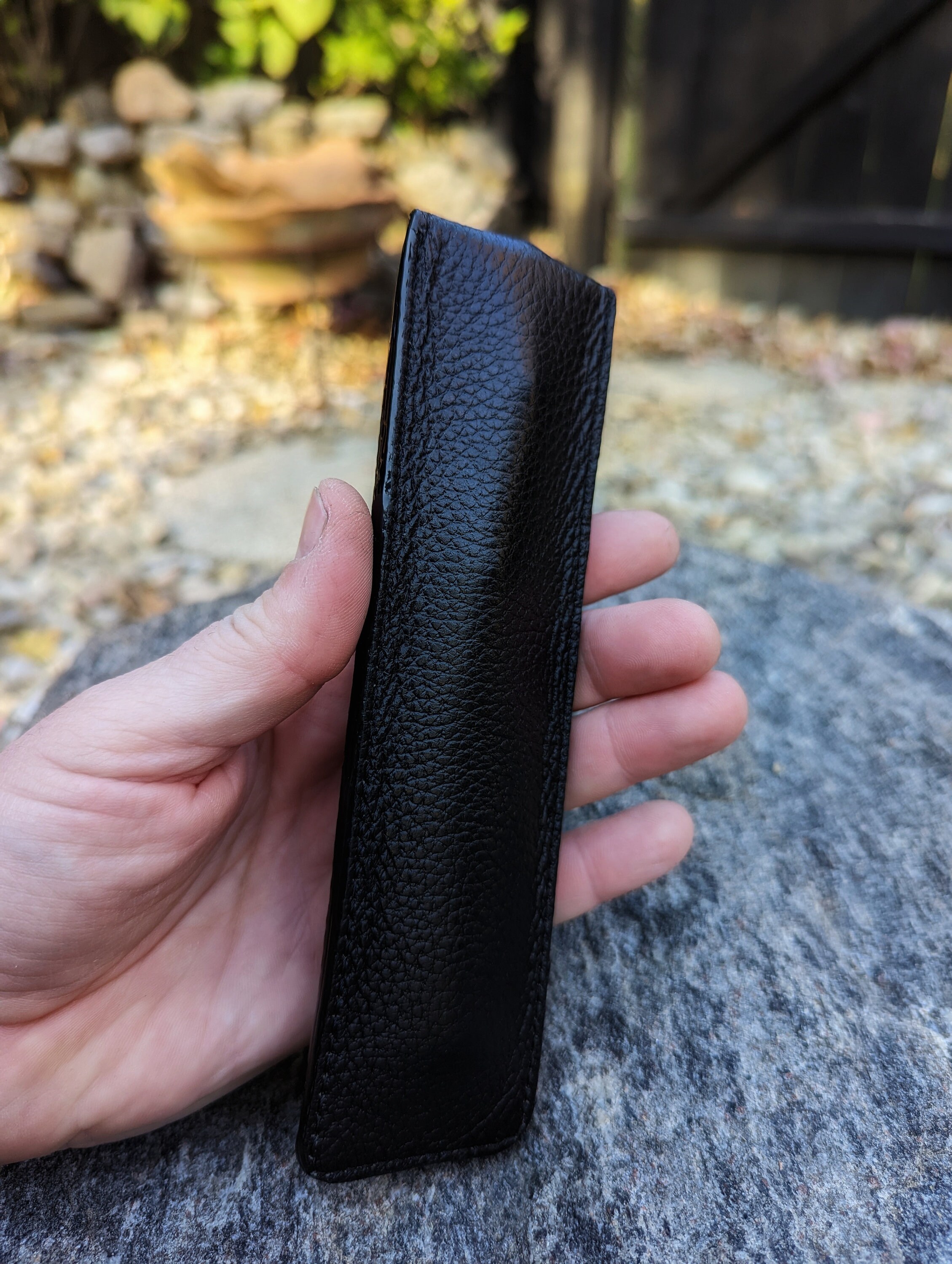 Black textured Straight razor Material lined Sturdy closure