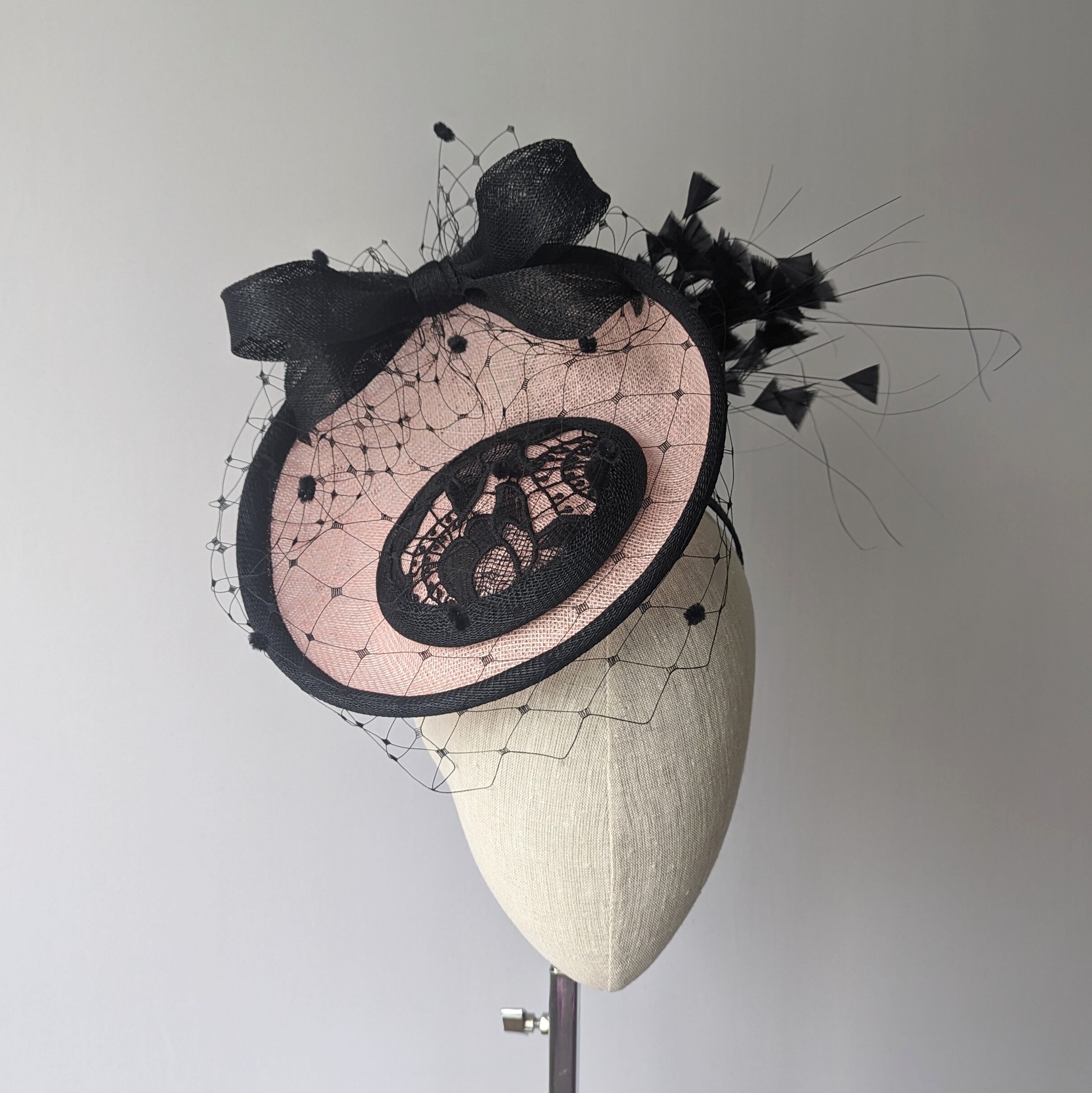 Pink and black percher hat