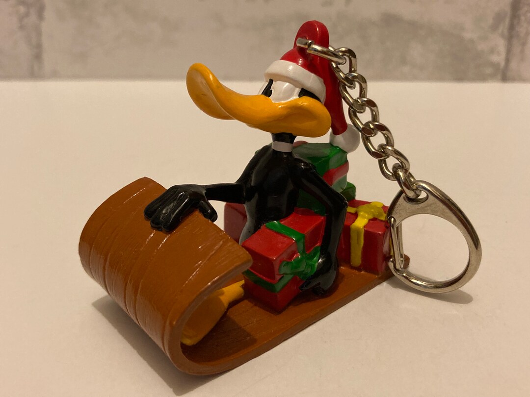 DAFFY Duck Sled of Presents Keychain Plastic PVC Figure Looney Tunes ...