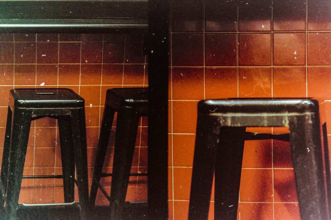 Wall Decor | Film Scan of Black Stools Against Bright Red Vintage Tile ...