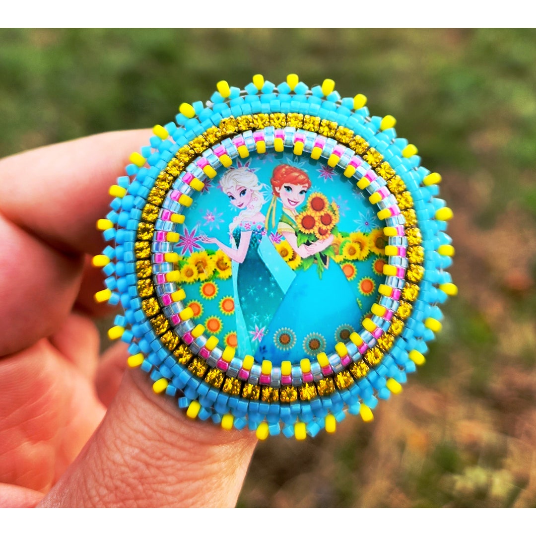 Frozen Elegance: Blue Elsa and Anna Glass Cabochon Brooch With Japanese ...