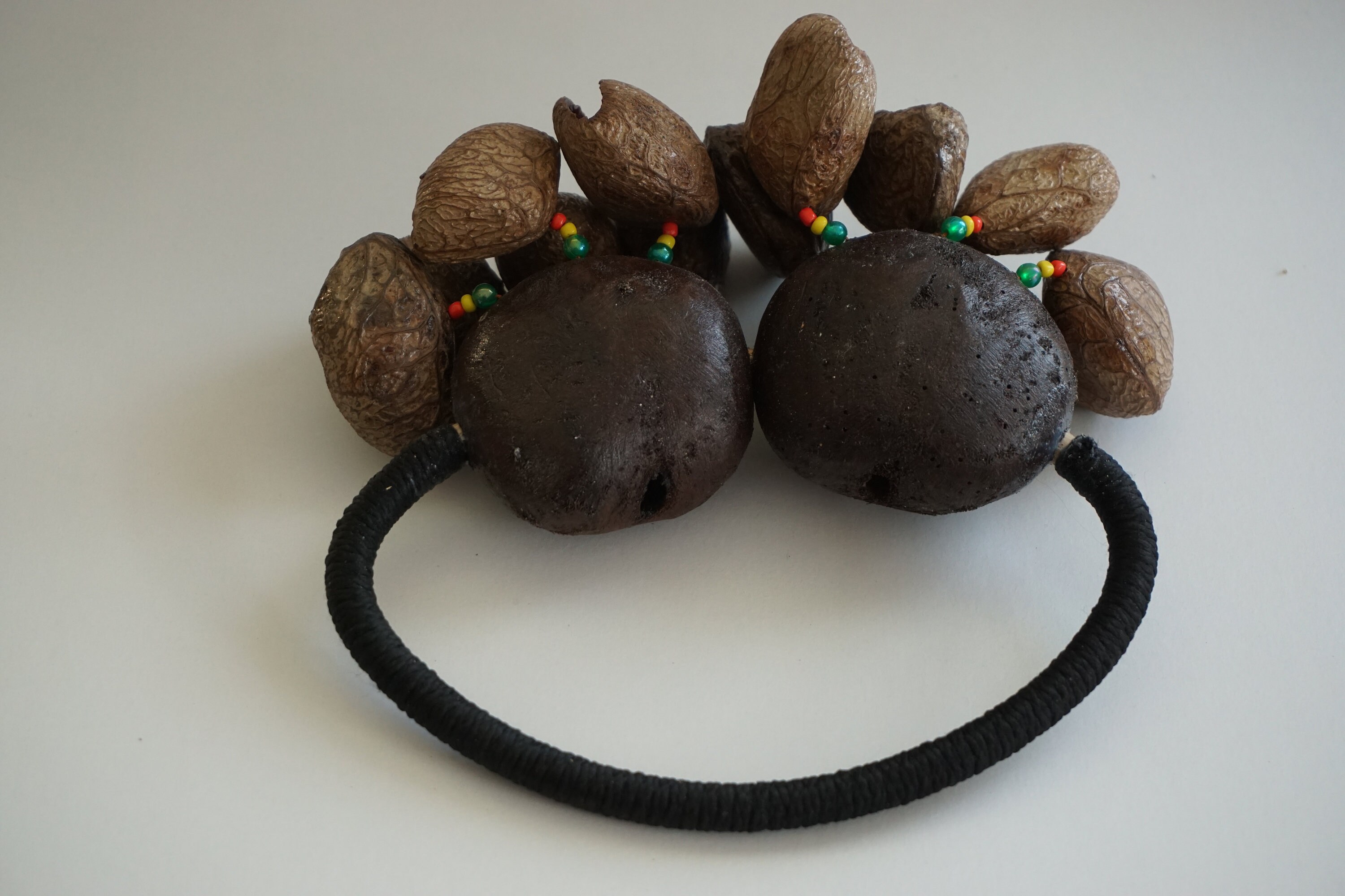 A Hand-held Shaker made of Tree Nut Shells Handicraft | Etsy