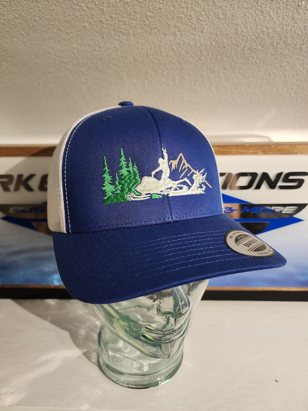 Sasquatch Rock on Snowmobile Scene | Yeti Embroidered Snapback Mesh ...