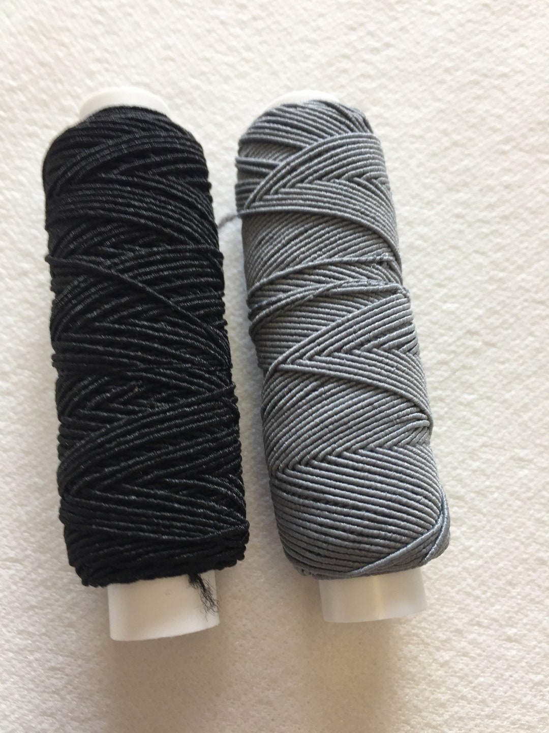 Shirring Shearing Pack of 2 Reels, Black & Mid Grey ,elastic Thread 20 ...