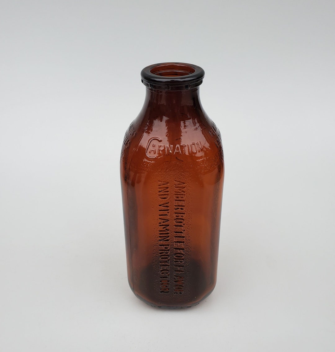 Vintage Carnation Milk Amber Embossed Bottle - 1 Quart - Raised ...