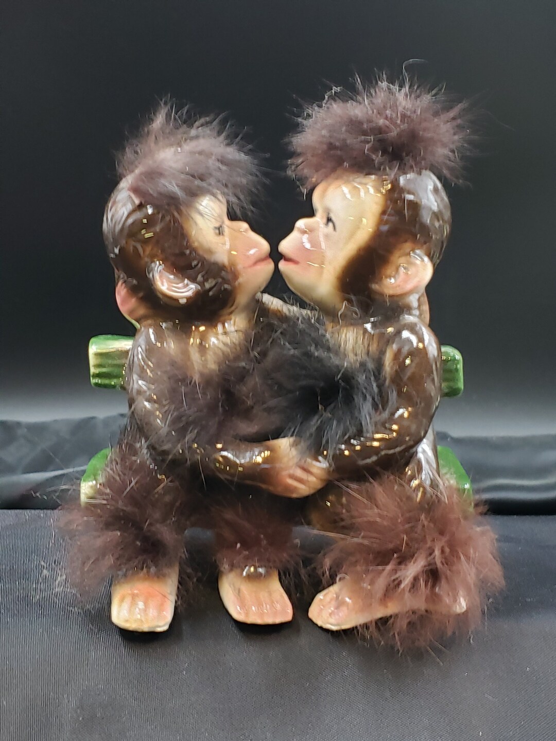 Monkeys in Love and Kissing on a Bench With Fur Trim by Bradley ...