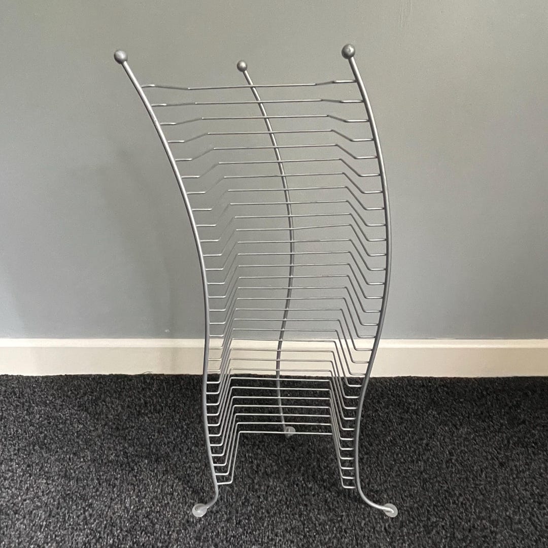 Metal Wavey Wire Silver DVD Storage Tower Rack, Stores 30 Dvds ...