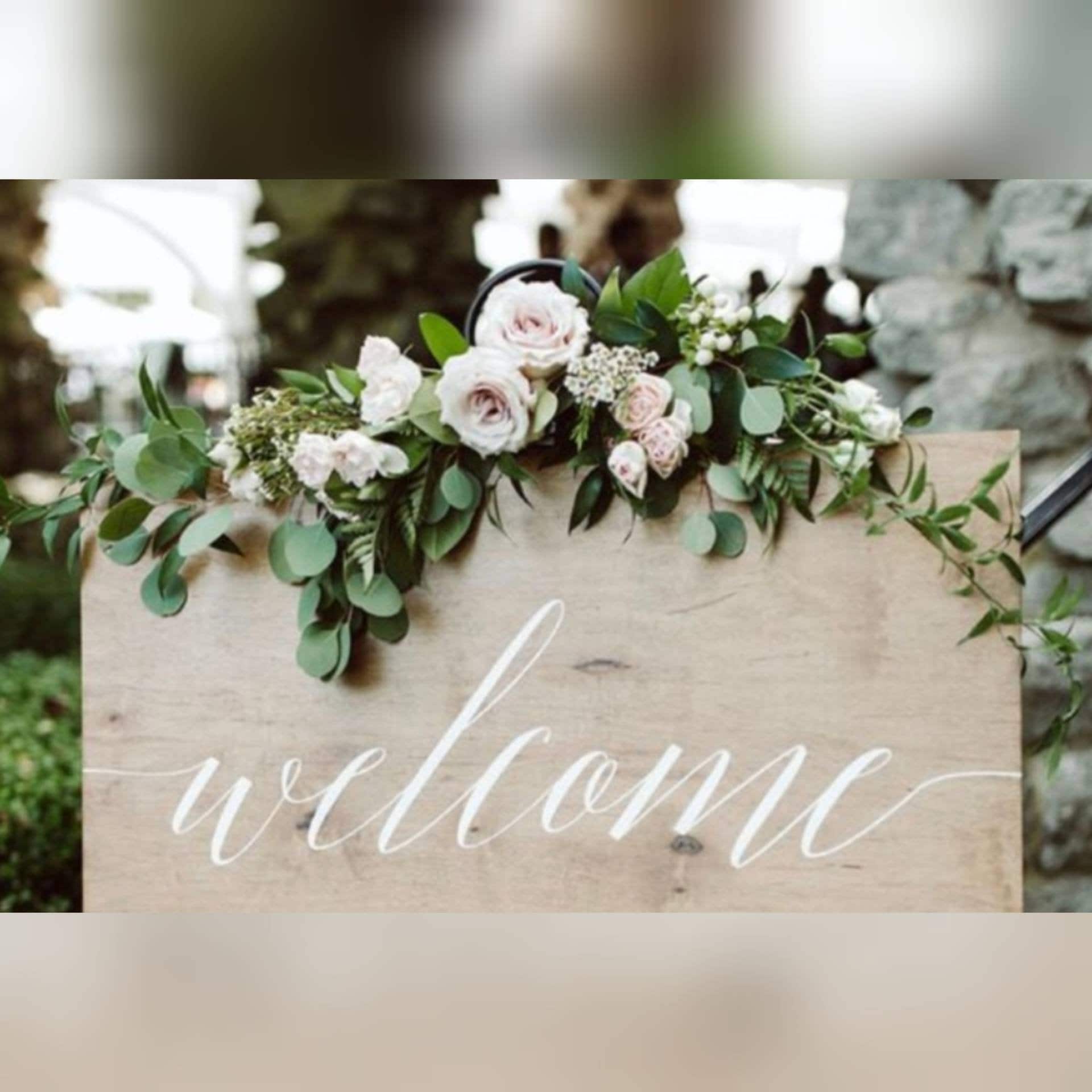 Wedding sign floral arrangement | Honestweddingadvice.com