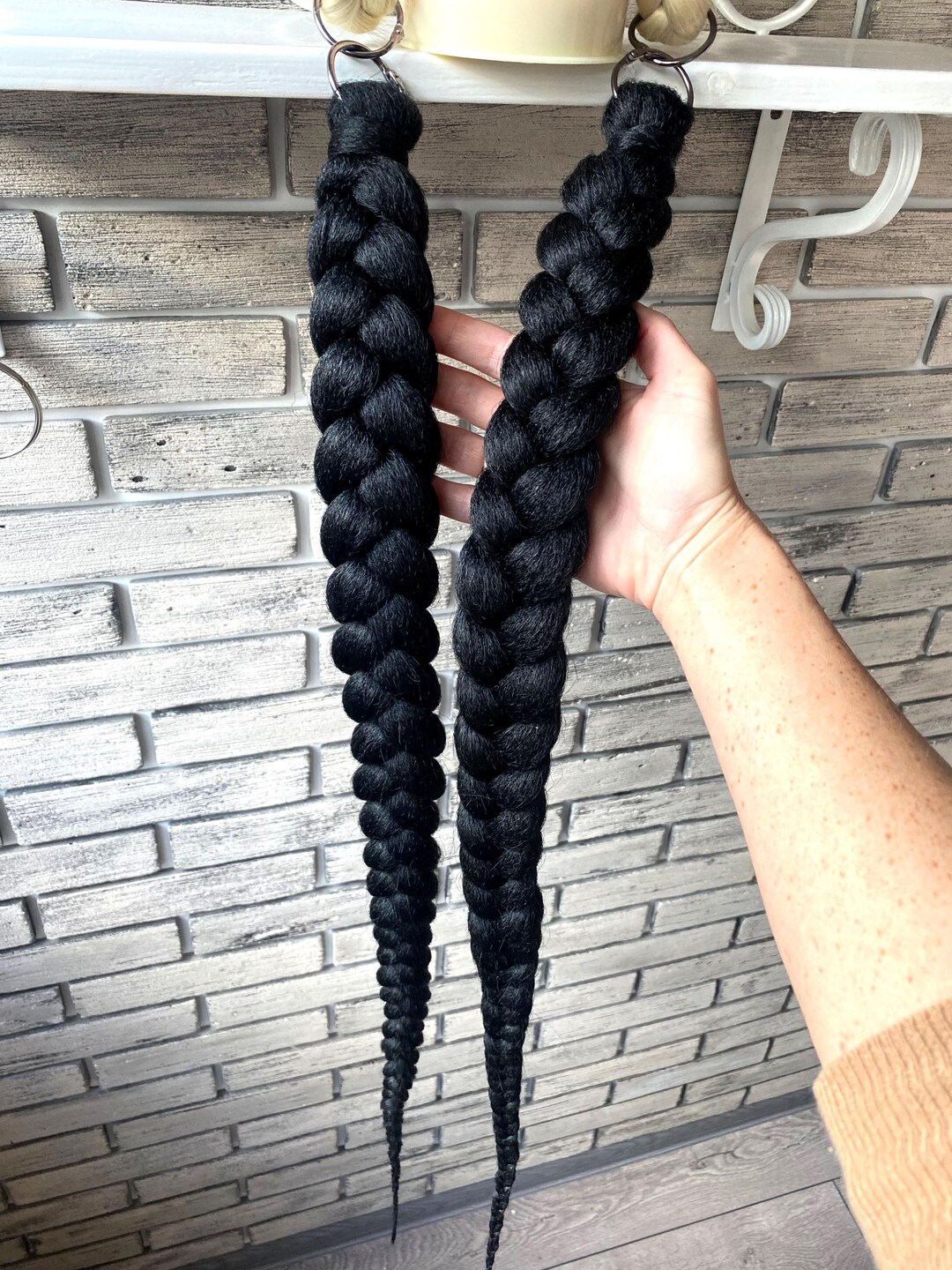 Two Black Braids on Metal Rings. Kanekalon, False Braids, Braid on an ...