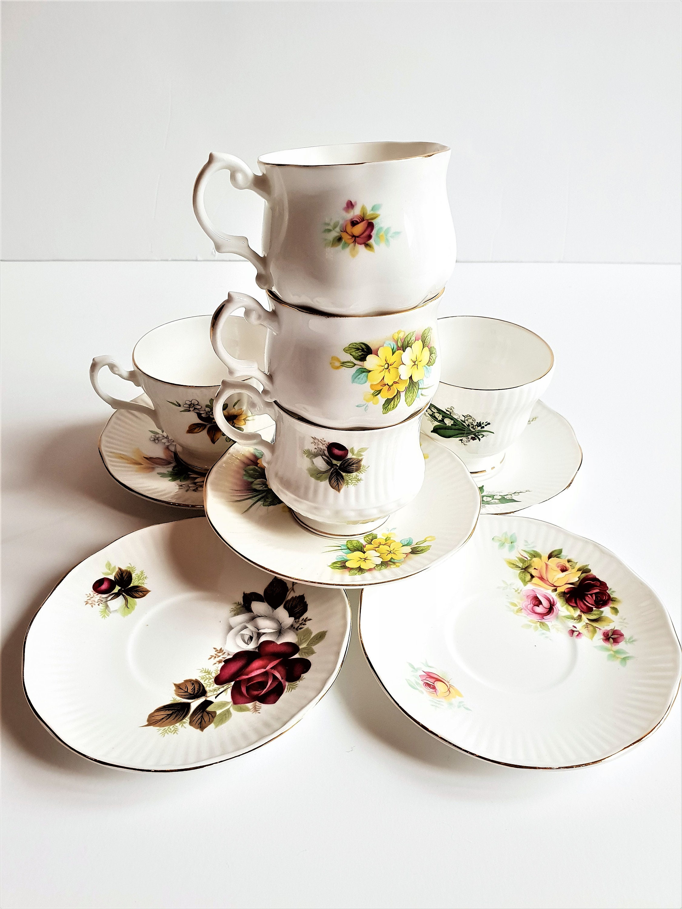 An Elegant Lot of FIVE Bone China Tea Set, Teacup and Saucer, High ...