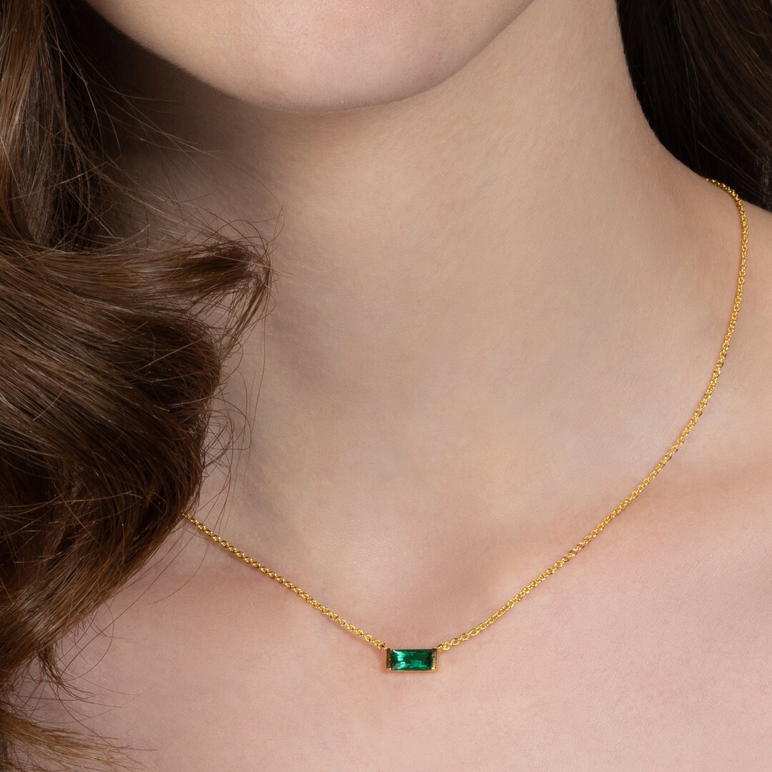 Long gold necklace with green stone store