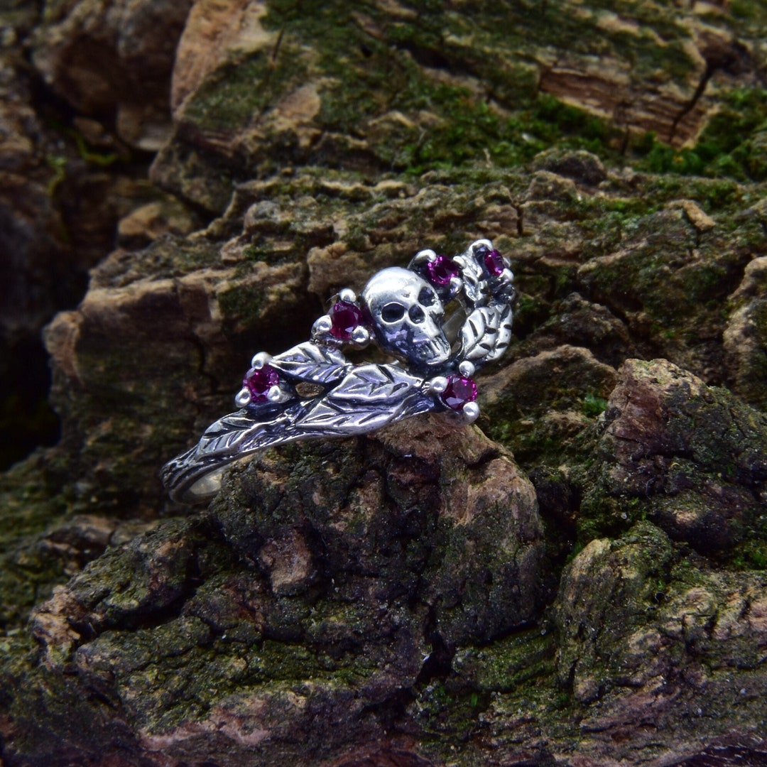 Minimalist Witch Wedding Ring With Carved Ruby Skull on Forest Leafy ...