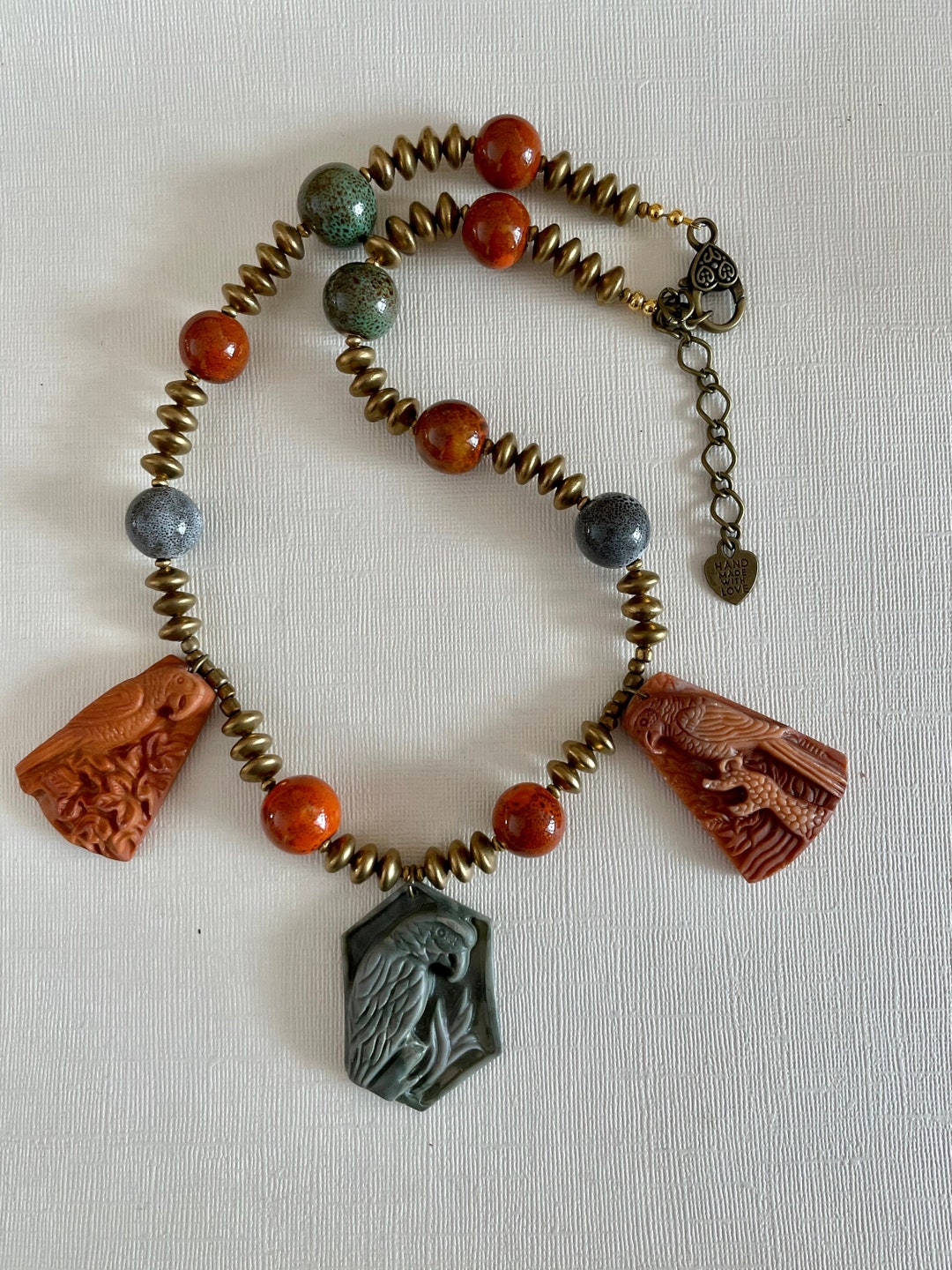 Birds of a Feather. Tryptic of Parrots Carved in Natural Red Malachite ...