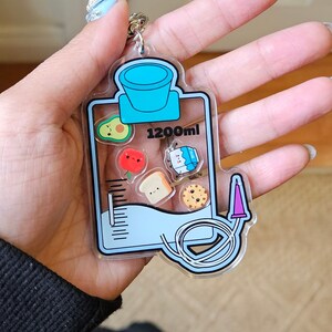 Tubie Feeding Shaker Keychain with 5 Cute & Happy Food Charms, Double ...