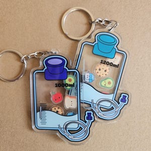 Tubie Feeding Shaker Keychain (with 5 Cute & Happy Food Charms, Double ...