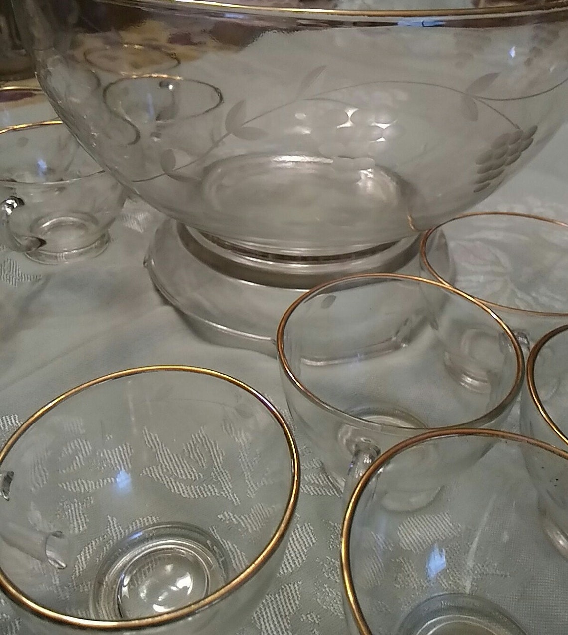 A 14 Piece Punch Bowl Set With a Grape Etched Design on Matching Glass ...